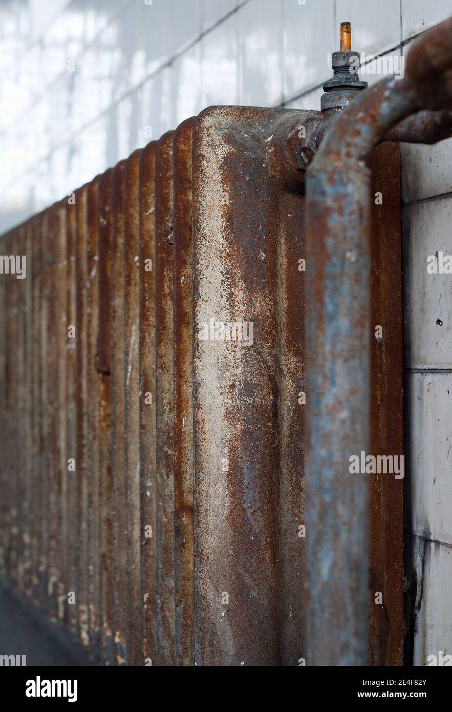 Locker room of an old industrial factory: Old rusty radiator Stock ...