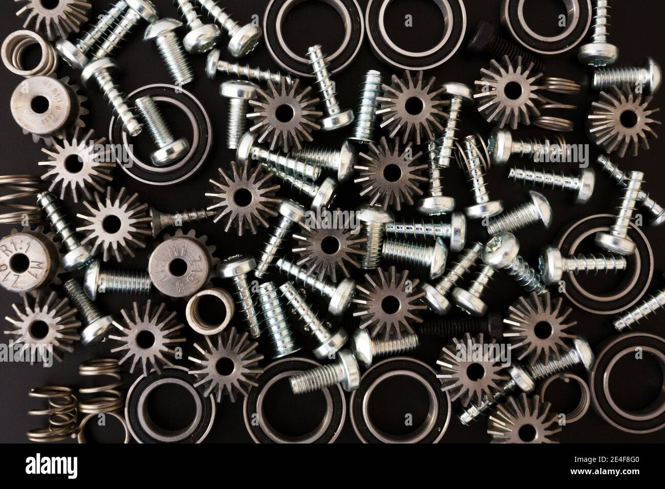 Background with mechanical components, gears, springs, screws ...