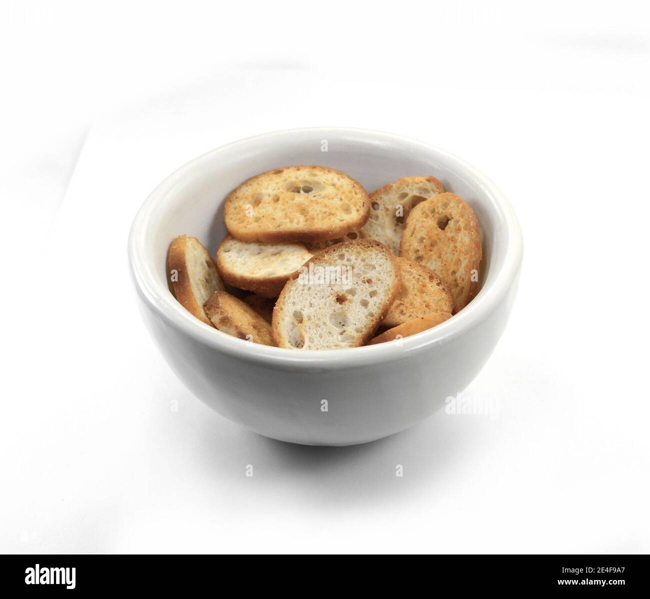 Bake rolls. Mini bread chips isolated on white background Stock Photo ...