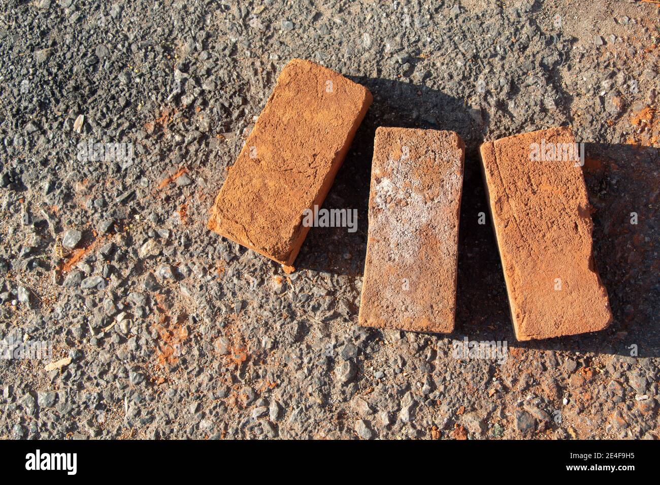 Top viof three brick blocks on a rough surface Stock Photo - Alamy