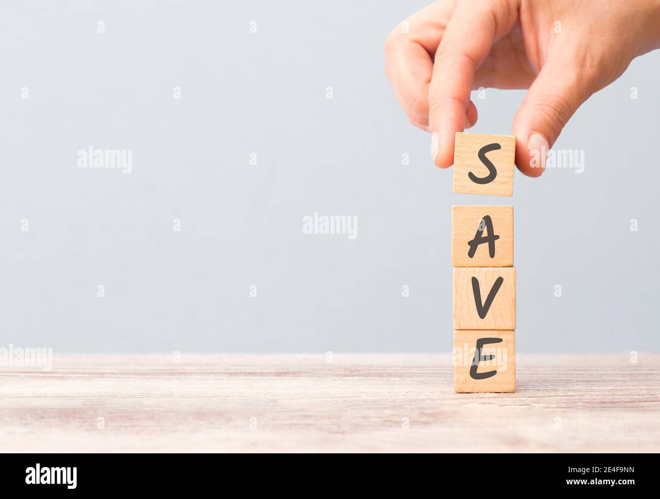 The word save is written on wooden cubes that are piled up Stock Photo ...
