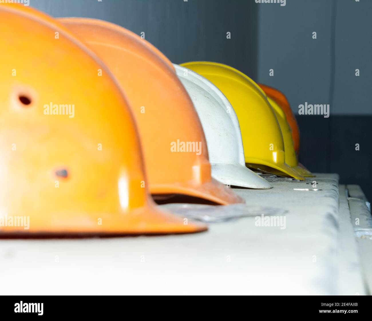 Orange plastic safety helmets hi-res stock photography and images - Alamy
