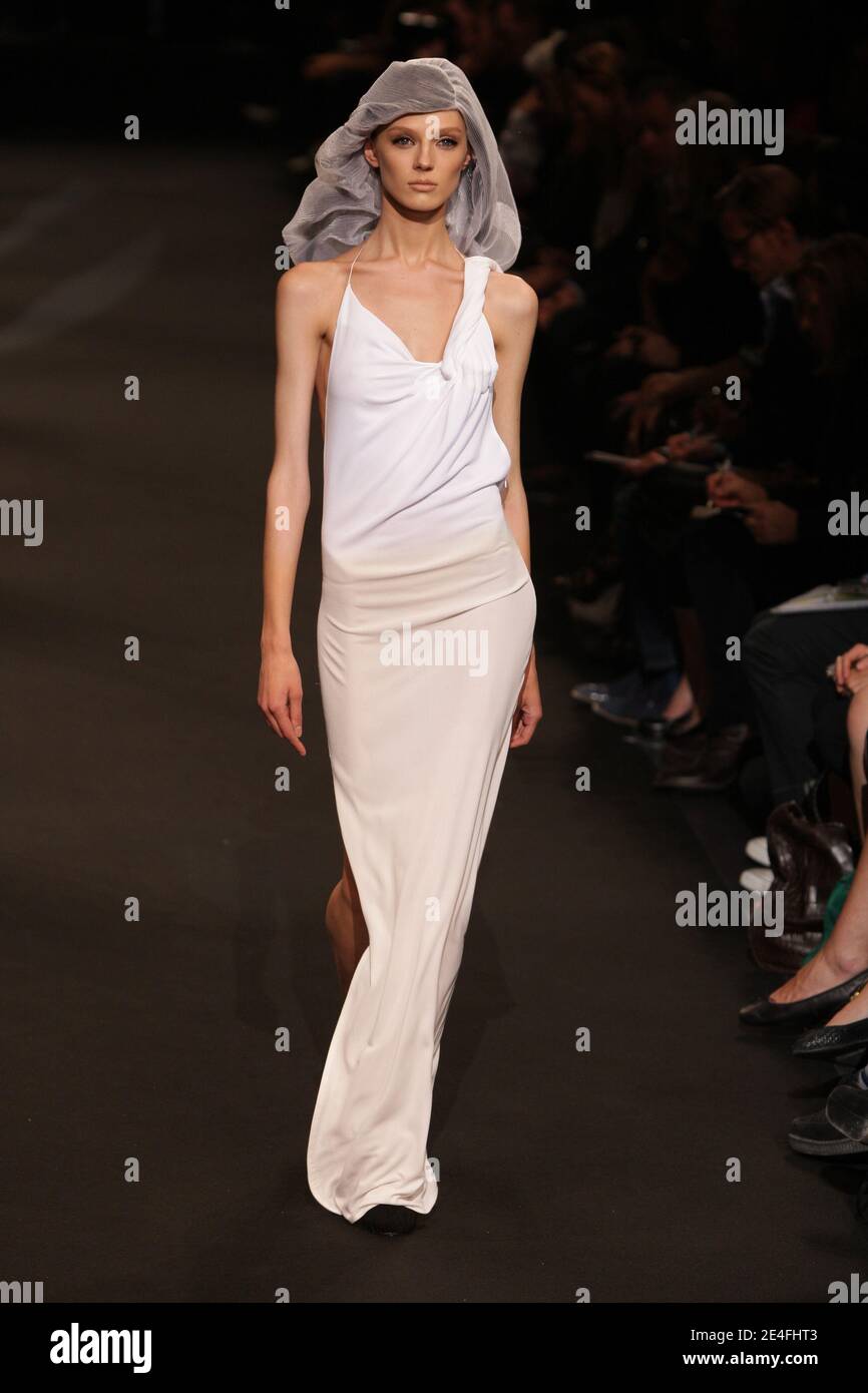 A model displays a creation by designer Hussein Chalayan for his Spring ...