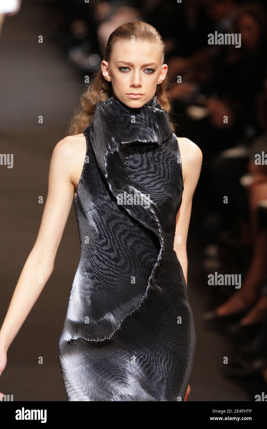 A model displays a creation by designer Hussein Chalayan for his Spring ...