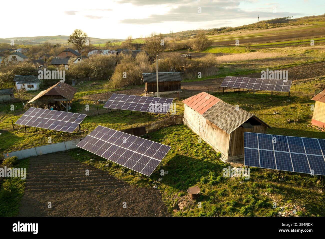 Aerial top down view of solar panels in green rural village yard Stock ...