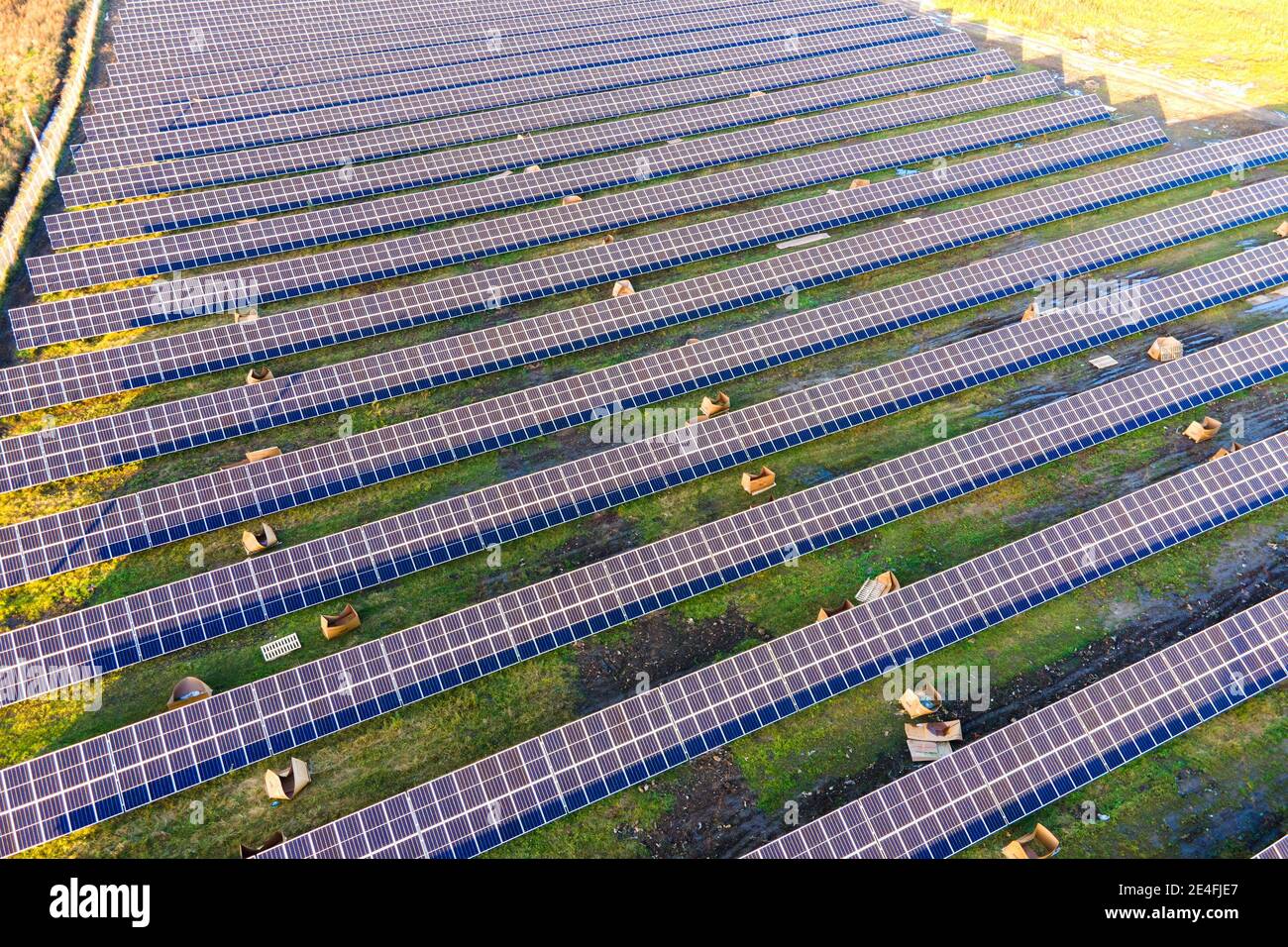 Aerial view of solar power plant under construction on green field ...