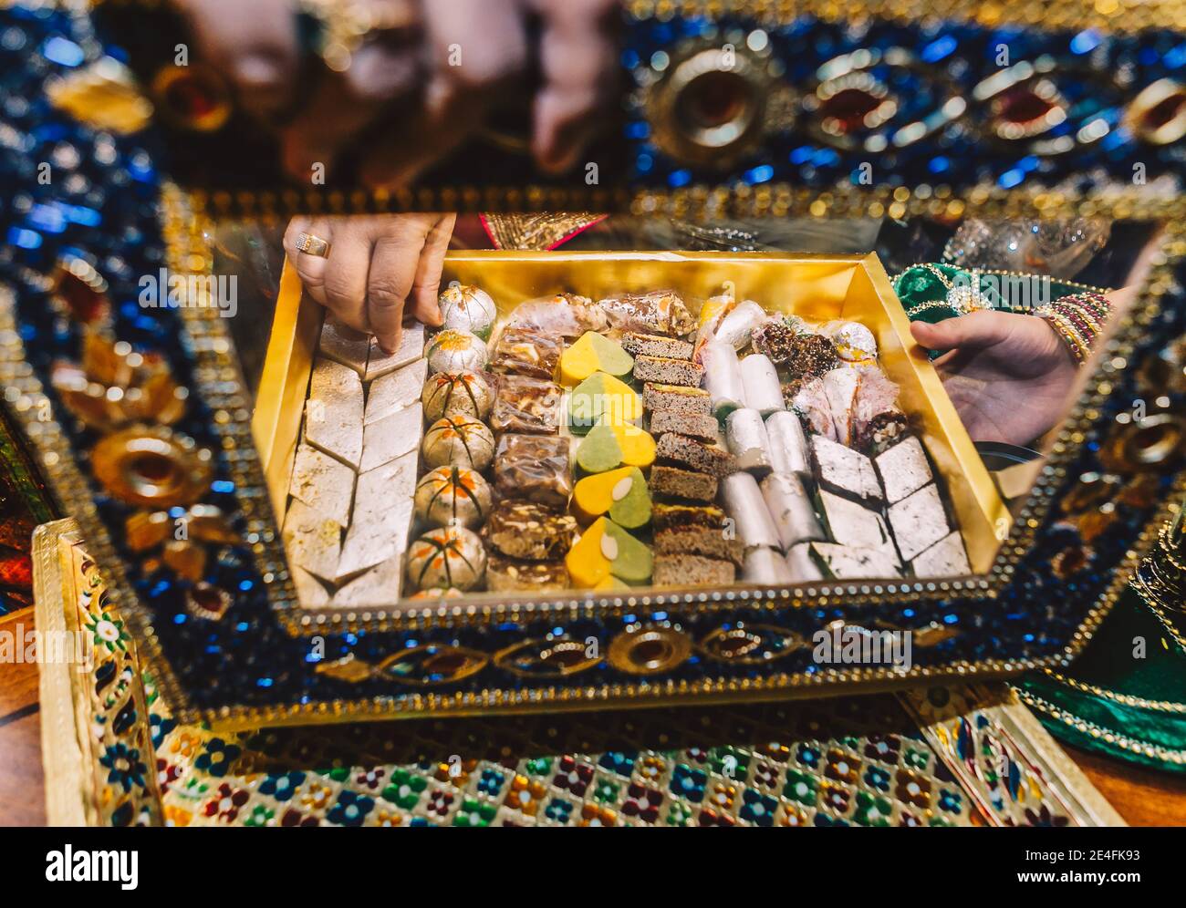 Female hand open luxury beautiful box inlaid with jewels with tasty ...