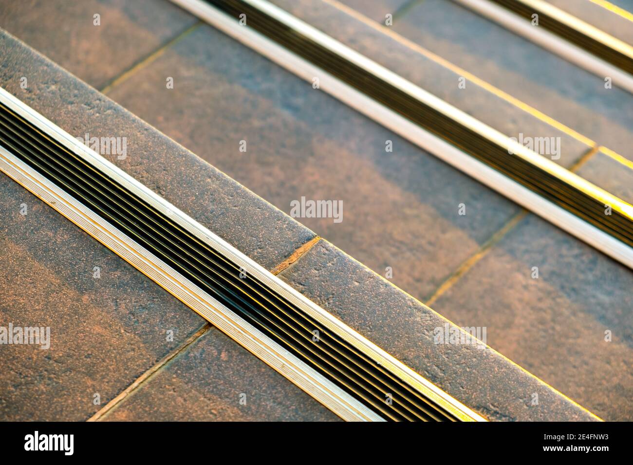 Closeup of ceramic tiles covering porch stairs with rubber anti ...