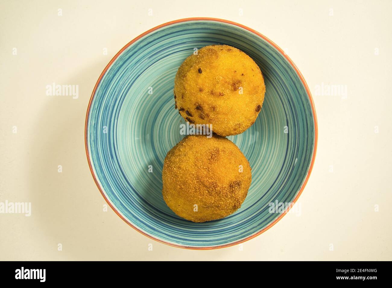 Italian appetizer arancini, rice balls stuffed with meat cooked in deep ...