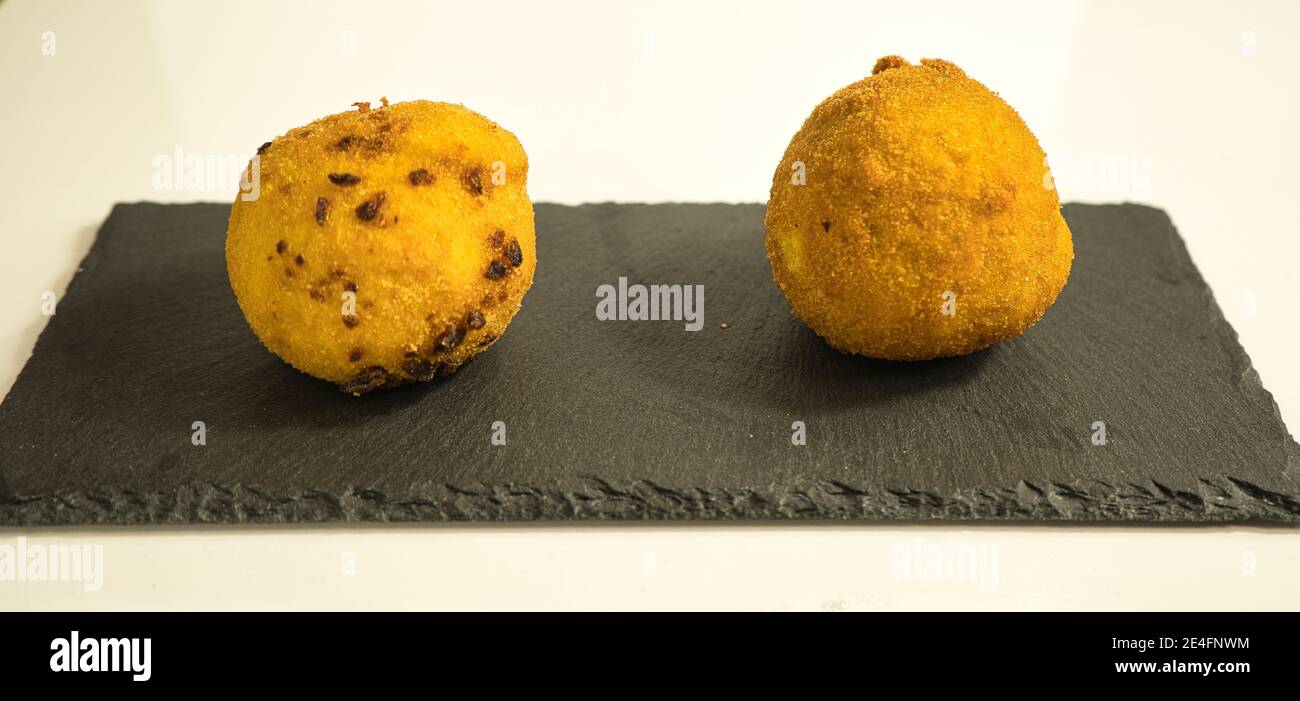 Italian appetizer arancini, rice balls stuffed with meat cooked in deep ...