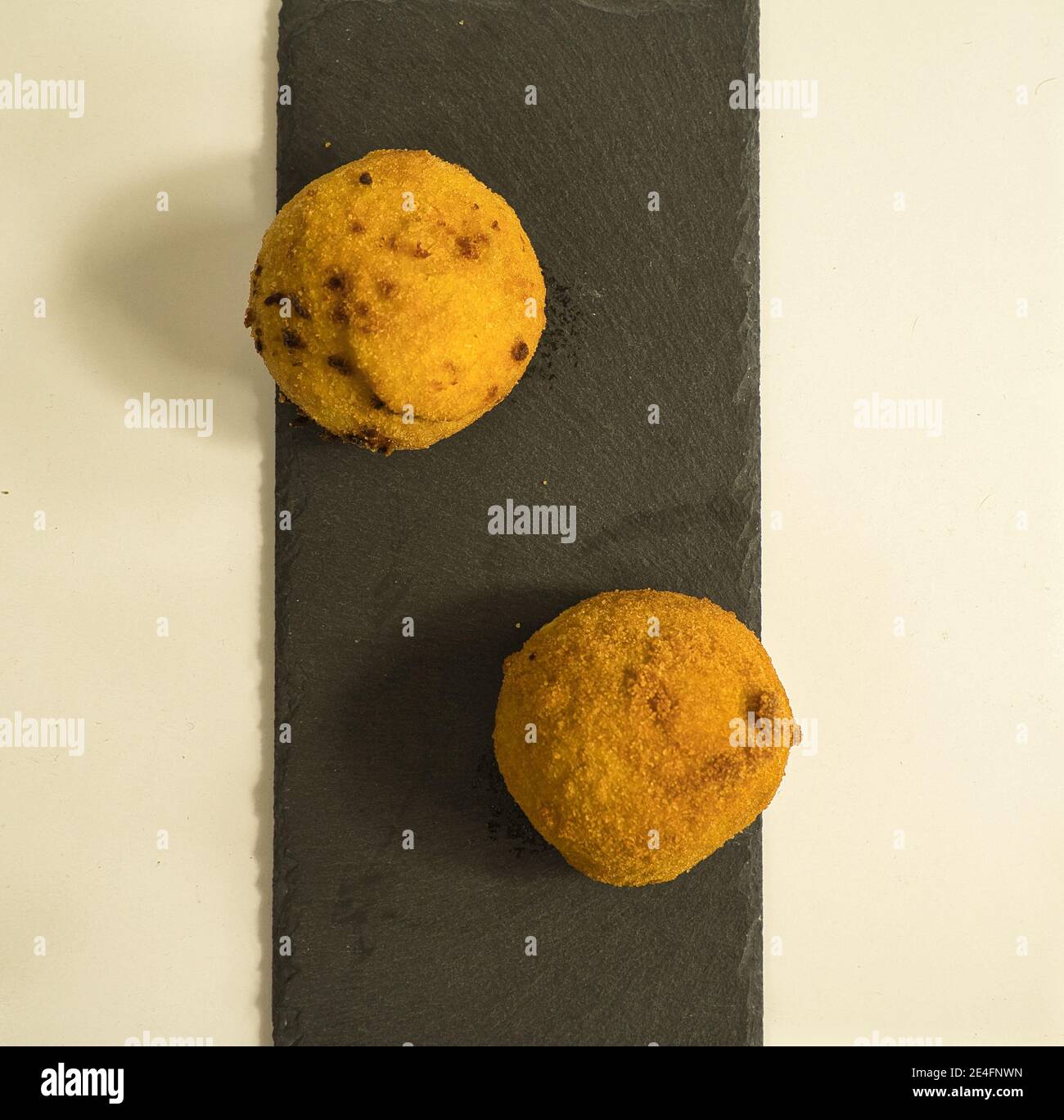Italian appetizer arancini, rice balls stuffed with meat cooked in deep ...