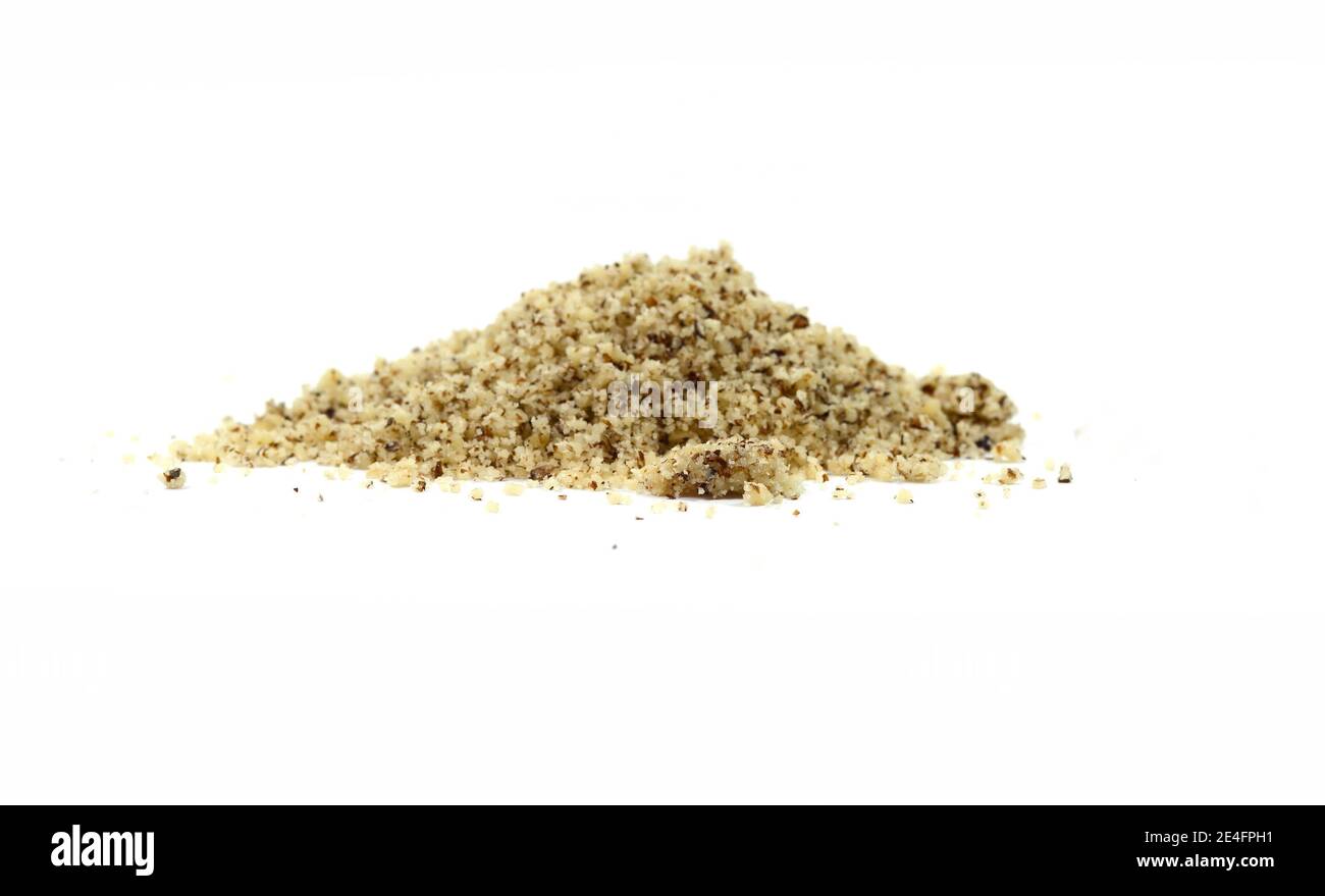 Ground walnuts powder on white. Chopped walnuts pile isolated on white ...