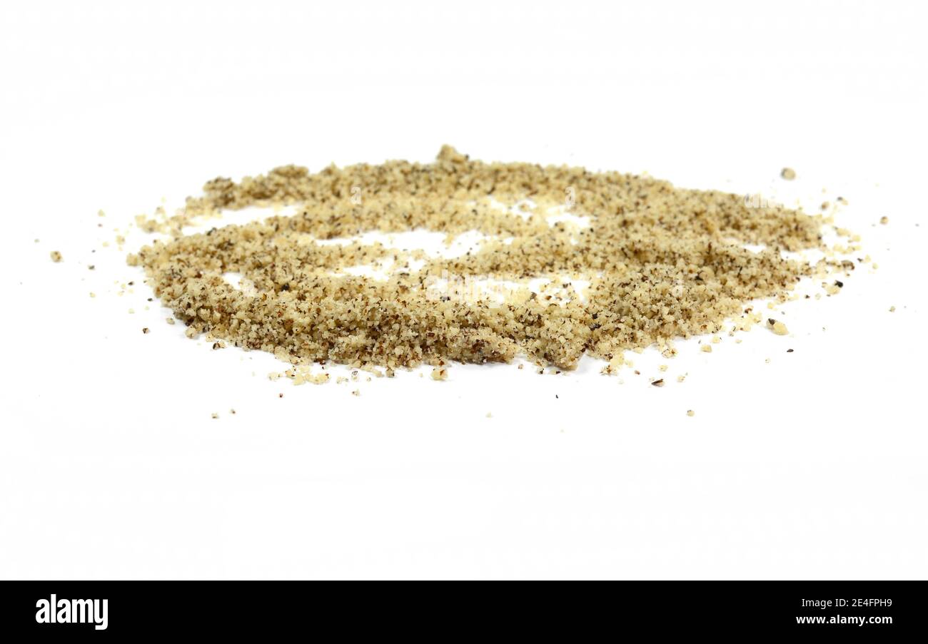 Ground walnuts powder on white. Chopped walnuts pile isolated on white ...