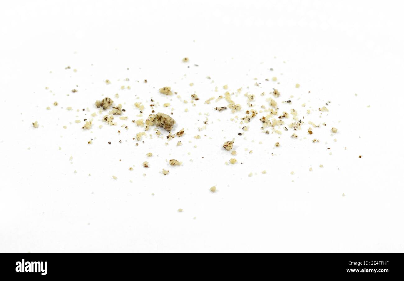 Ground walnuts powder on white. Chopped walnuts pile isolated on white ...