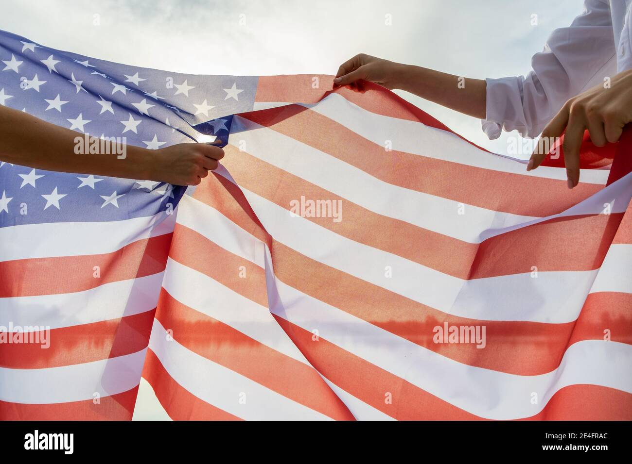 Two human hands holding USA national flag. Celebration of United States ...