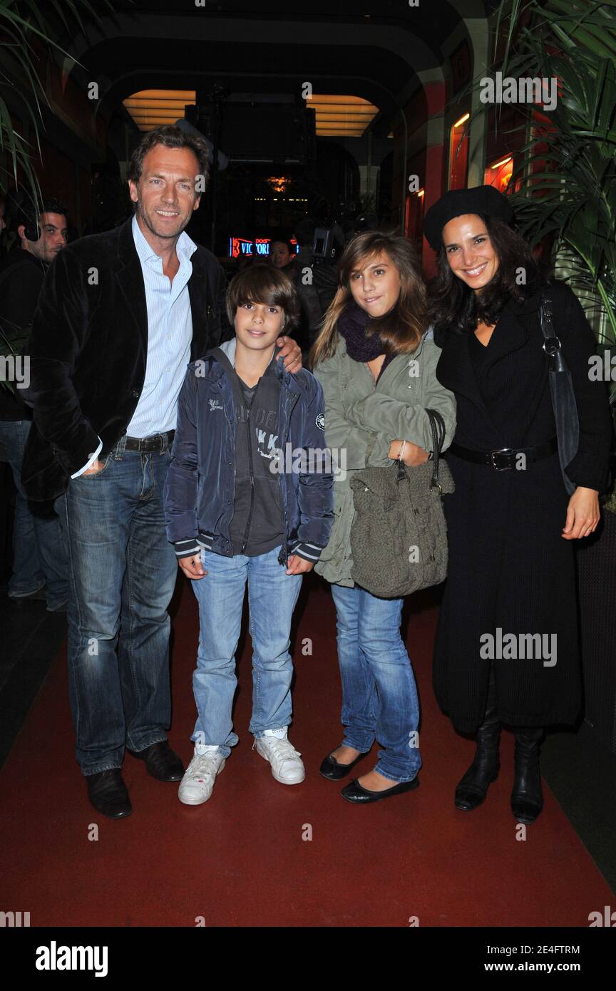 Stephane Freiss with his wife anf their children pose at Musee Grevin ...