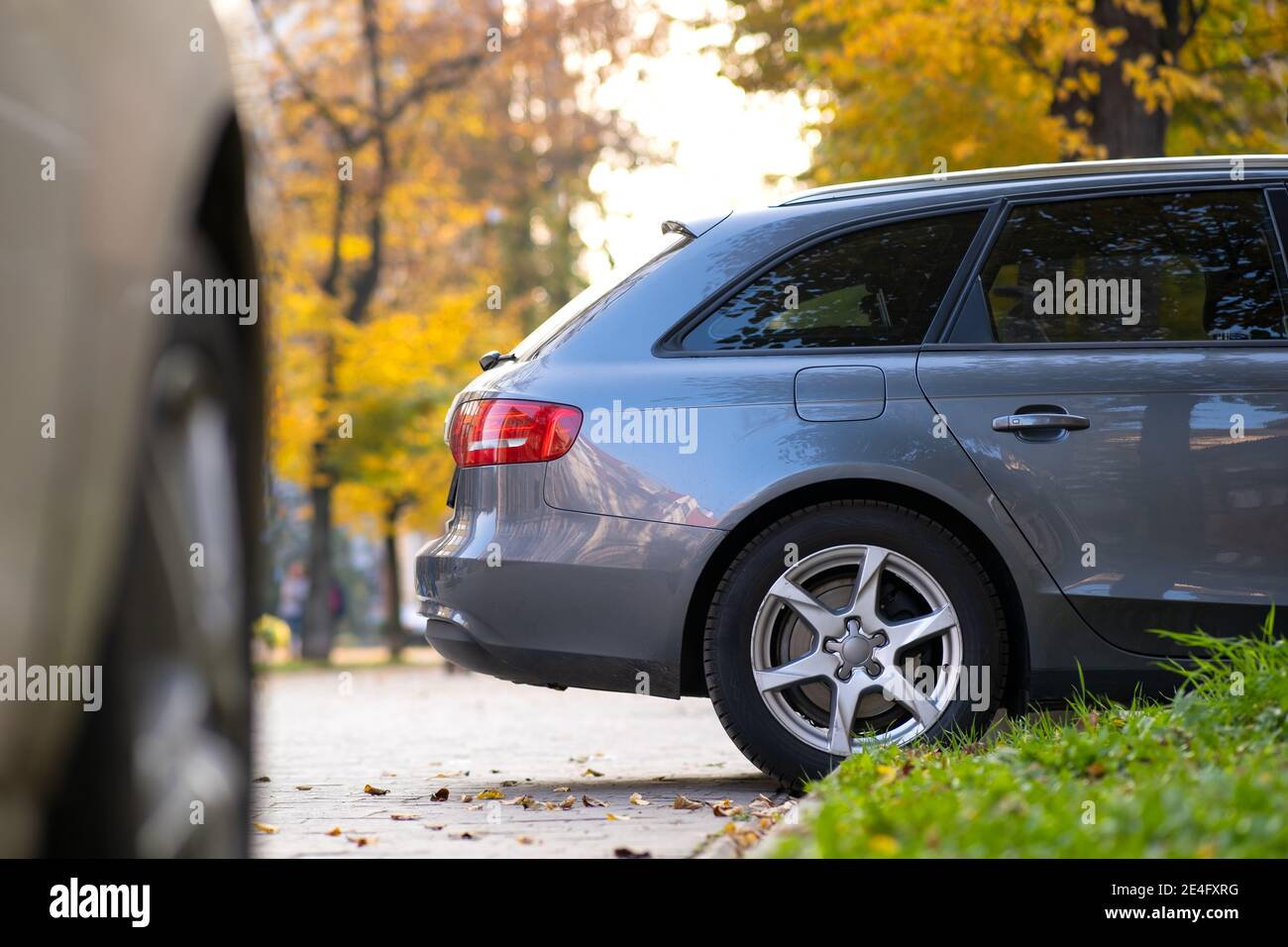 New clean car parked on a city street side Stock Photo - Alamy