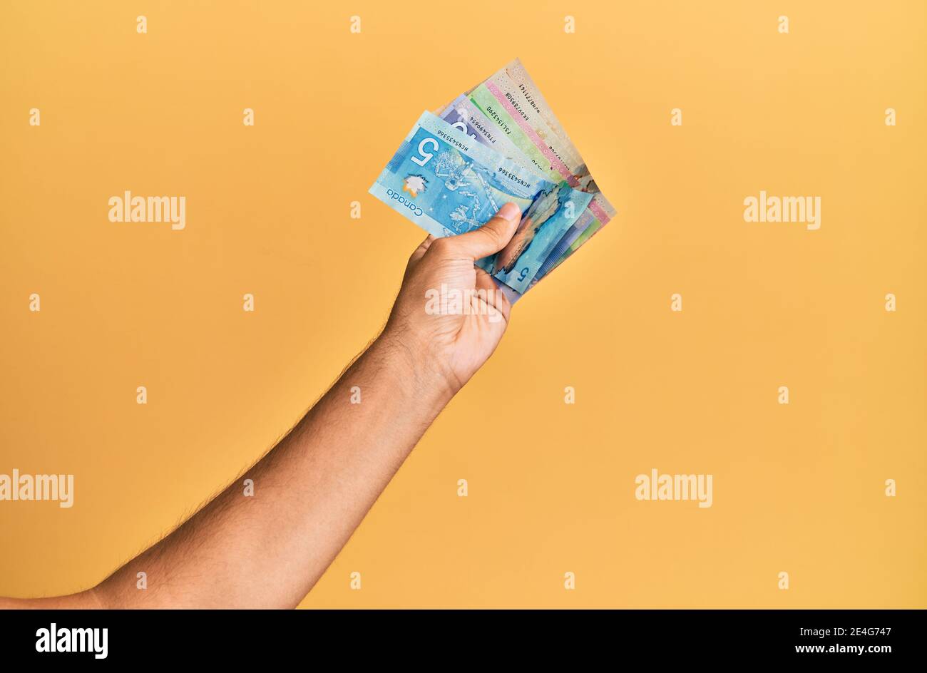 Yellow human hand holding credit hi-res stock photography and images ...