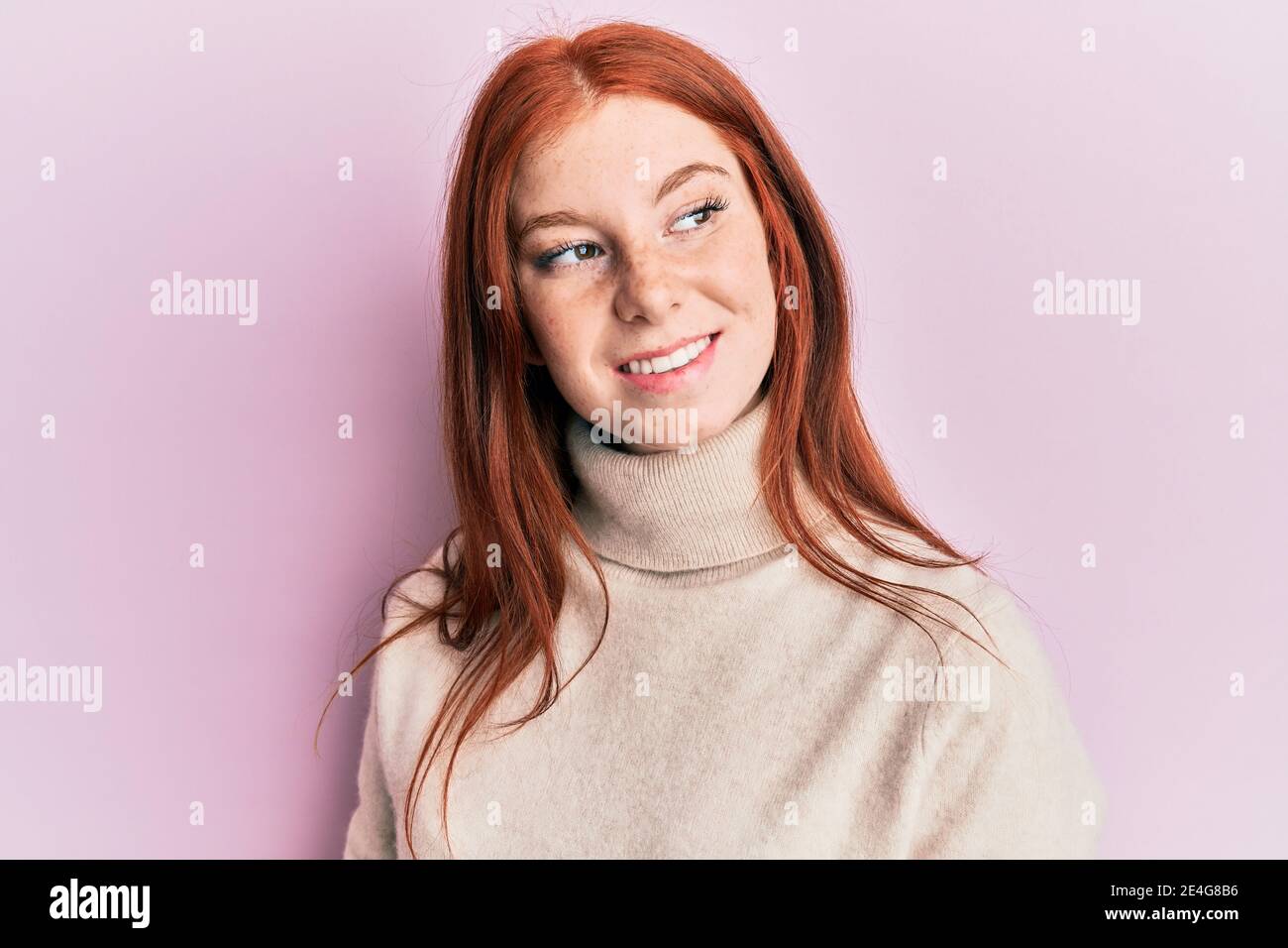 Young Red Head Girl Wearing Turtleneck Sweater Looking To Side Relax