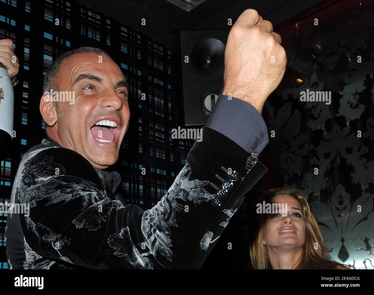 Christian Audigier and his wife attending the opening of Christian ...