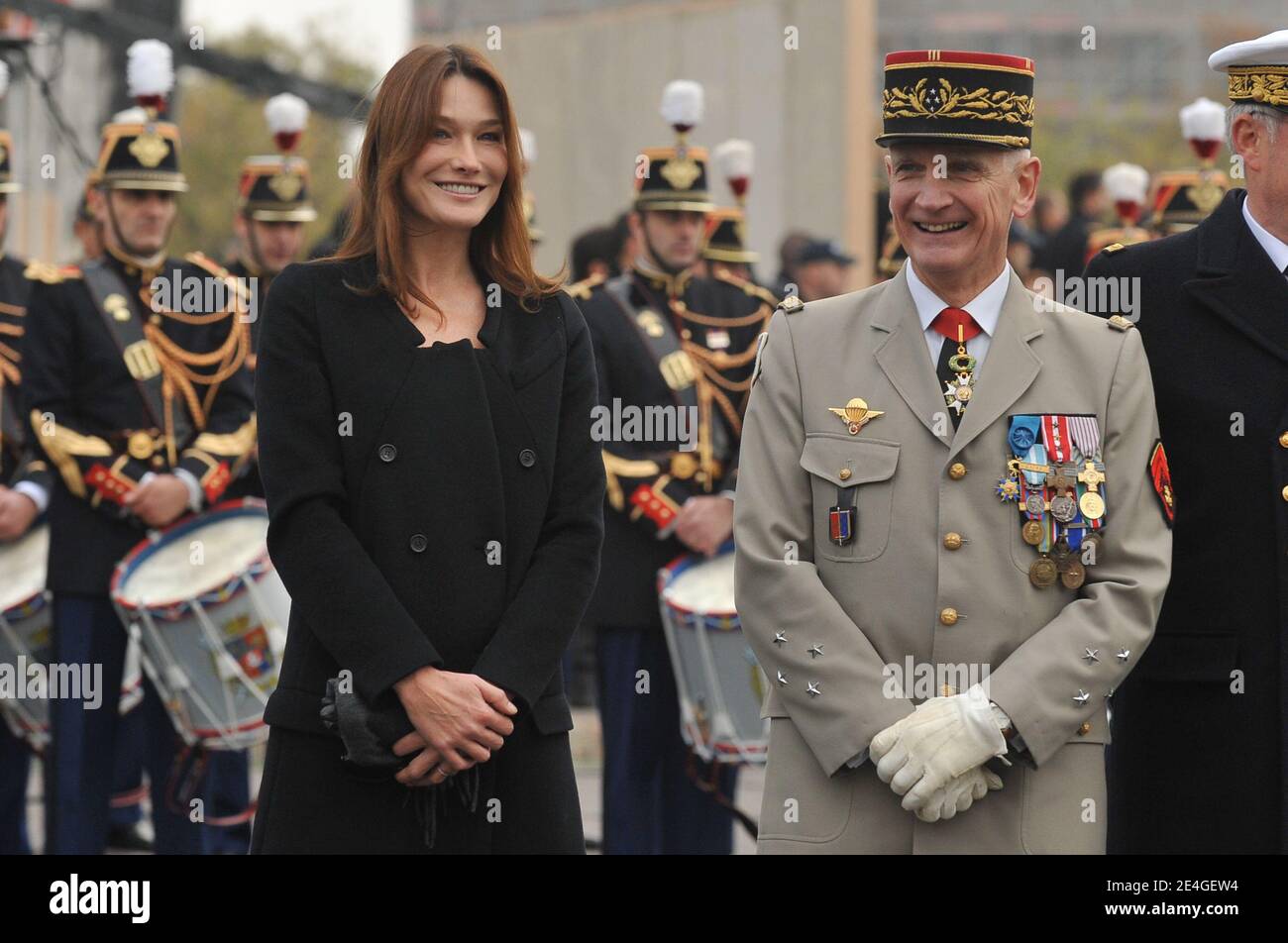 French First Lady Carla Bruni-Sarkozy and French army General Bruno ...
