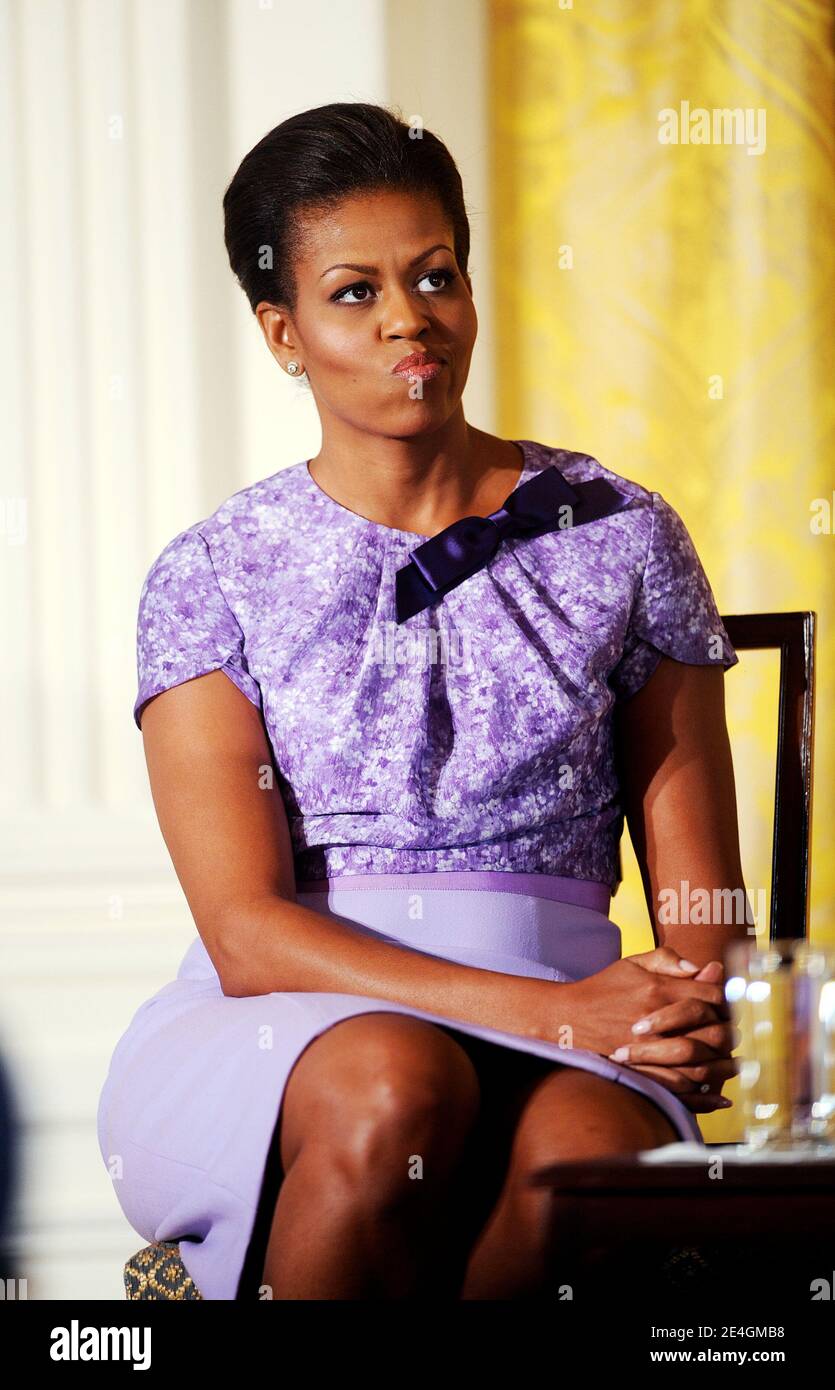 First Lady Michelle Obama listens during an event in the East Room of ...