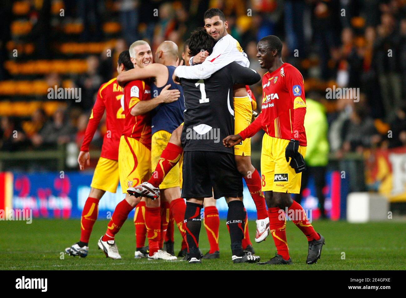 Lens' players celebrate at the end of the French First League soccer ...