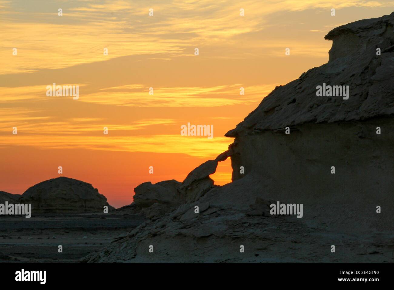 Sun rising in the Libyan desert, uncovering bizarre limestone ...