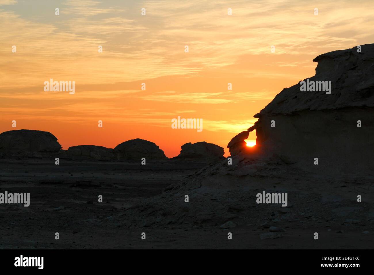 Sun rising in the Libyan desert, uncovering bizarre limestone ...