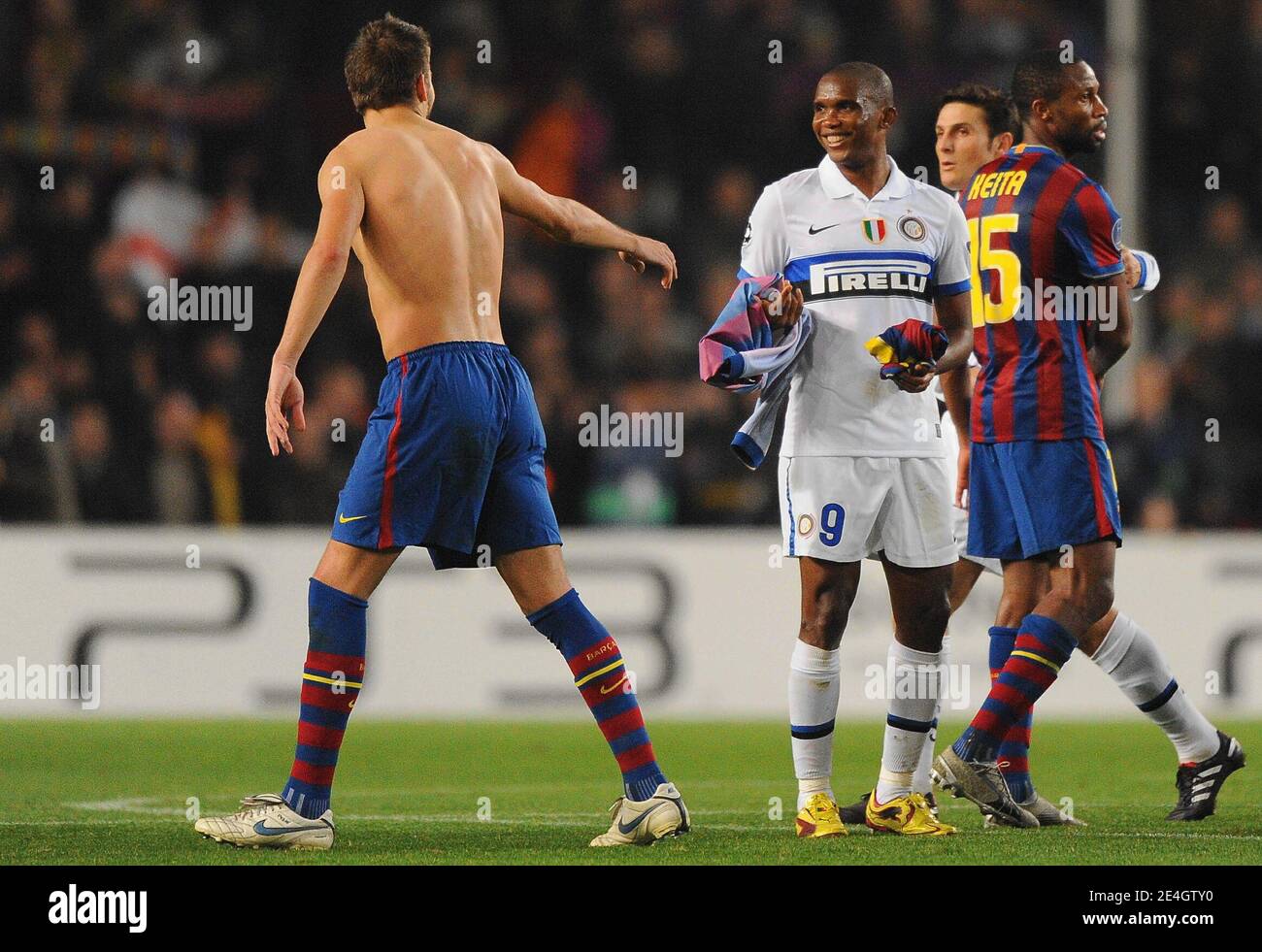 FC Barcelona's Gerard Pique gives his shirt to Inter Milan's Samuel Eto ...