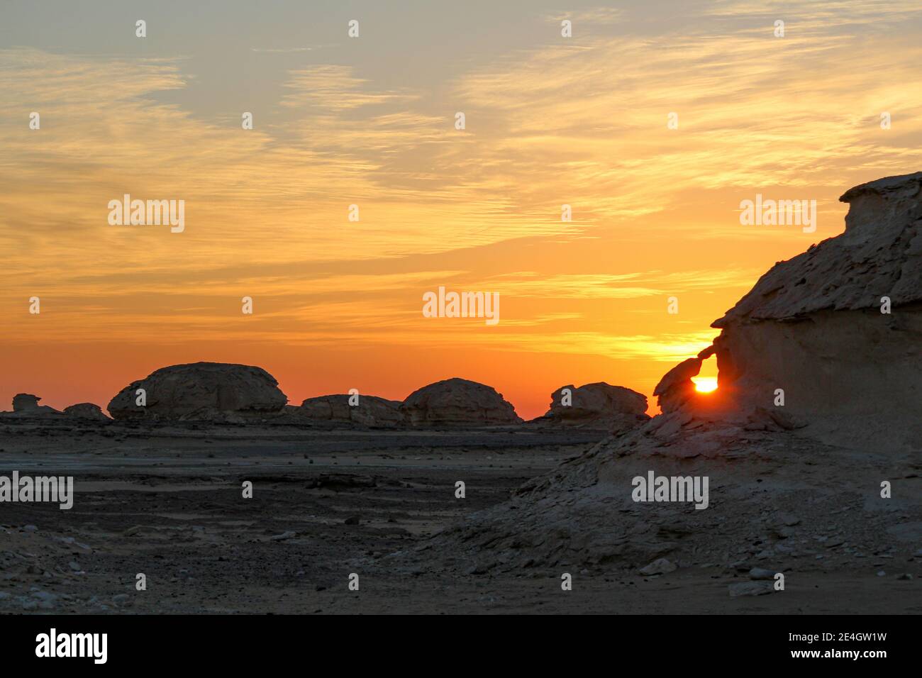 Sun rising in the Libyan desert, uncovering bizarre limestone ...