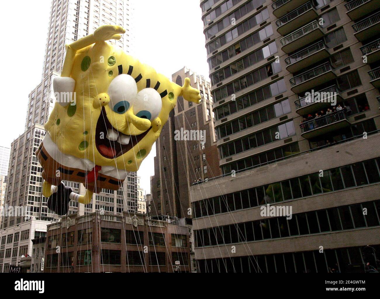 The SpongeBob SquarePants balloon hovers over onlookers in between ...