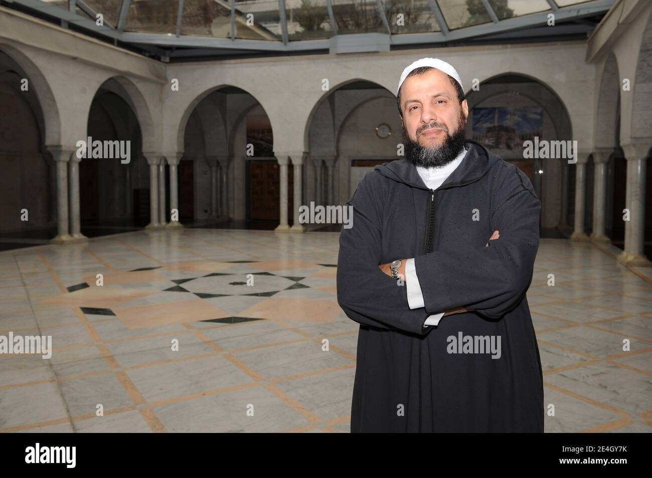 The imam at the Geneva mosque, Youssef Ibram poses at the mosque in the ...