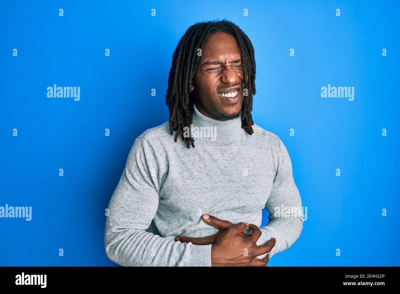 African american man with braids wearing turtleneck sweater with hand ...