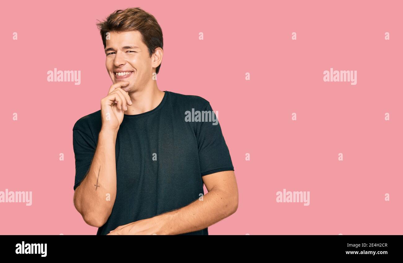 Handsome caucasian man wearing casual clothes looking confident at the ...