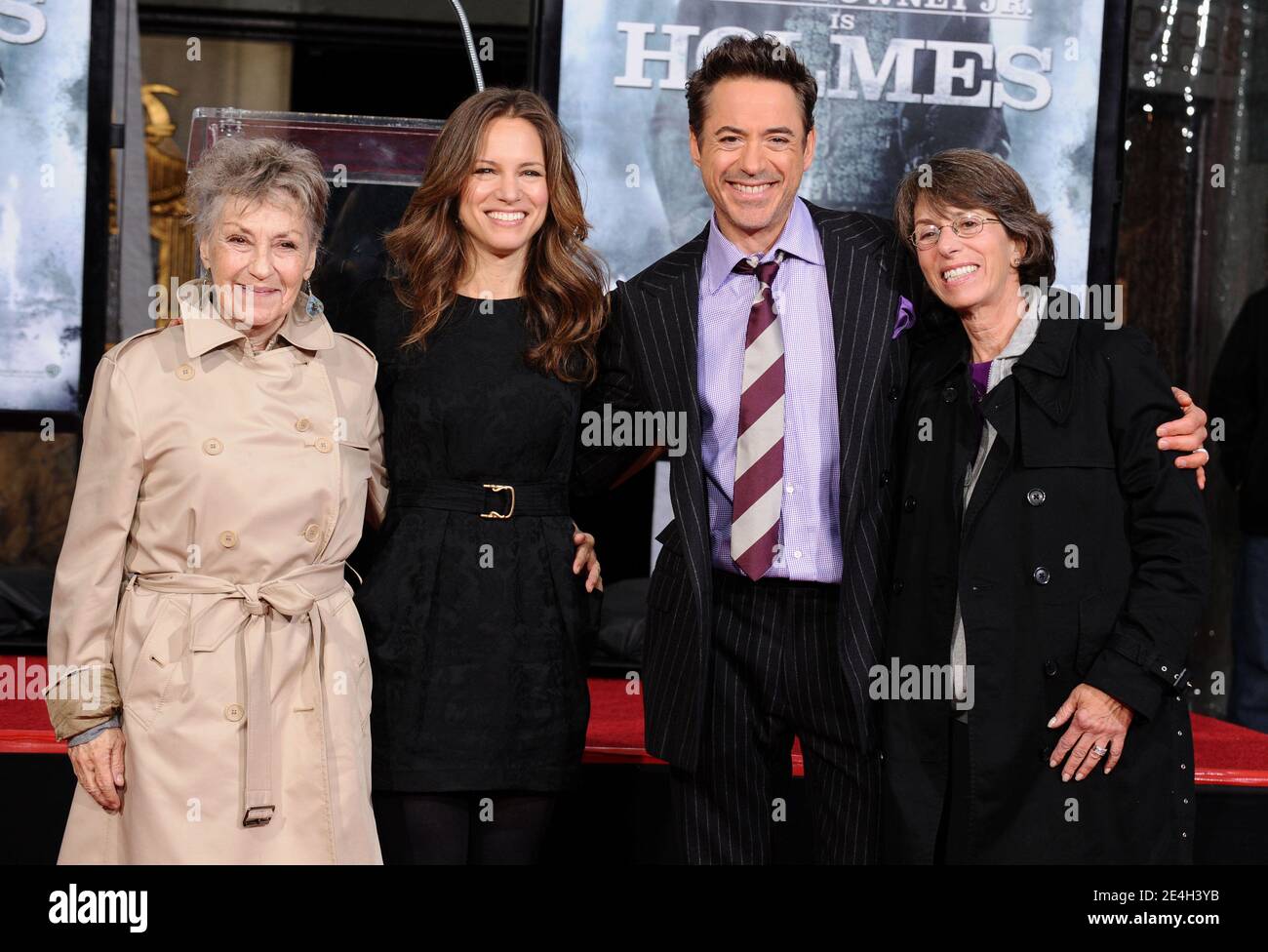 Robert Downey Jr. poses with his wife Susan Downey (2nd L) and his ...