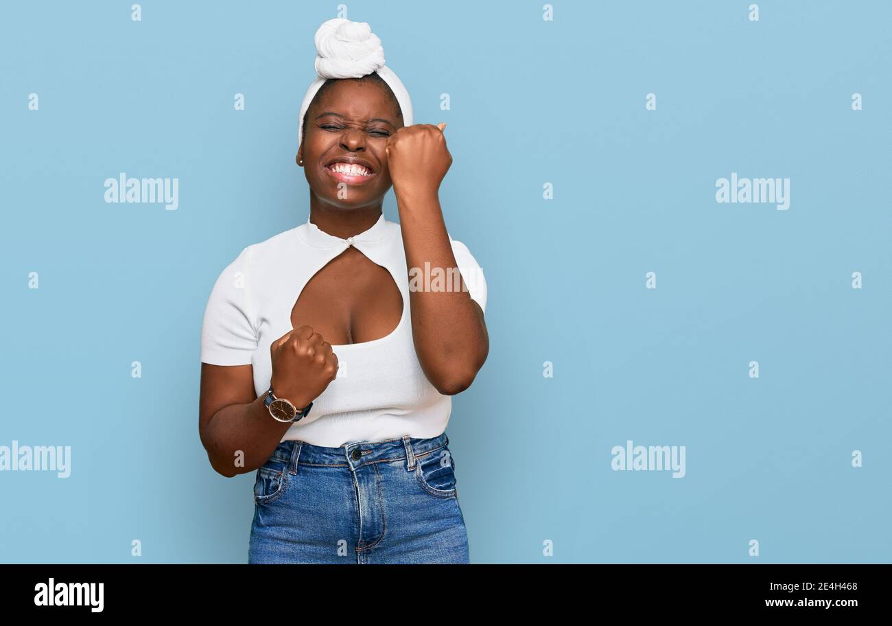 Young african woman with turban wearing hair turban over isolated ...