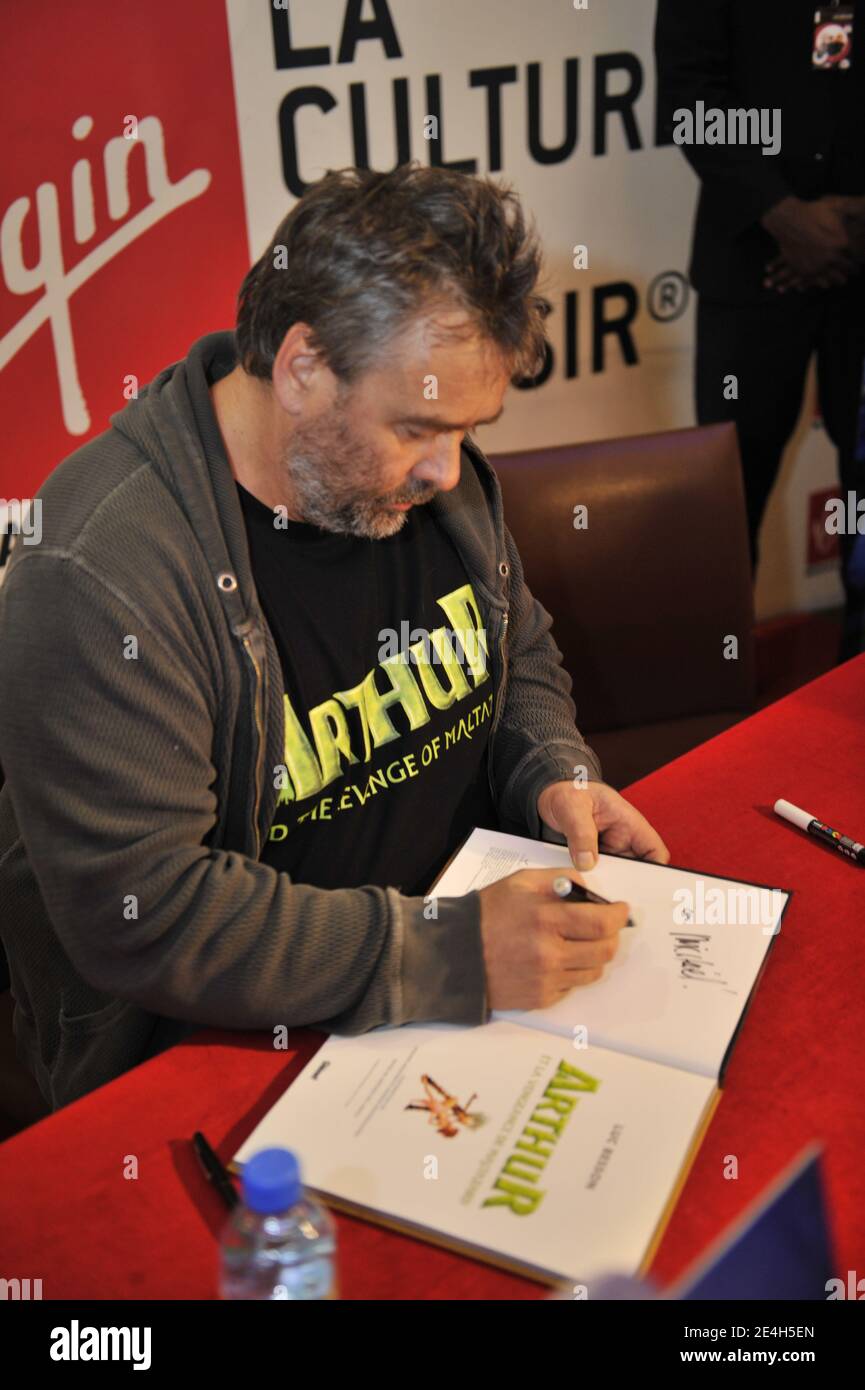 "French film director Luc Besson signs copies of his latest animated ...