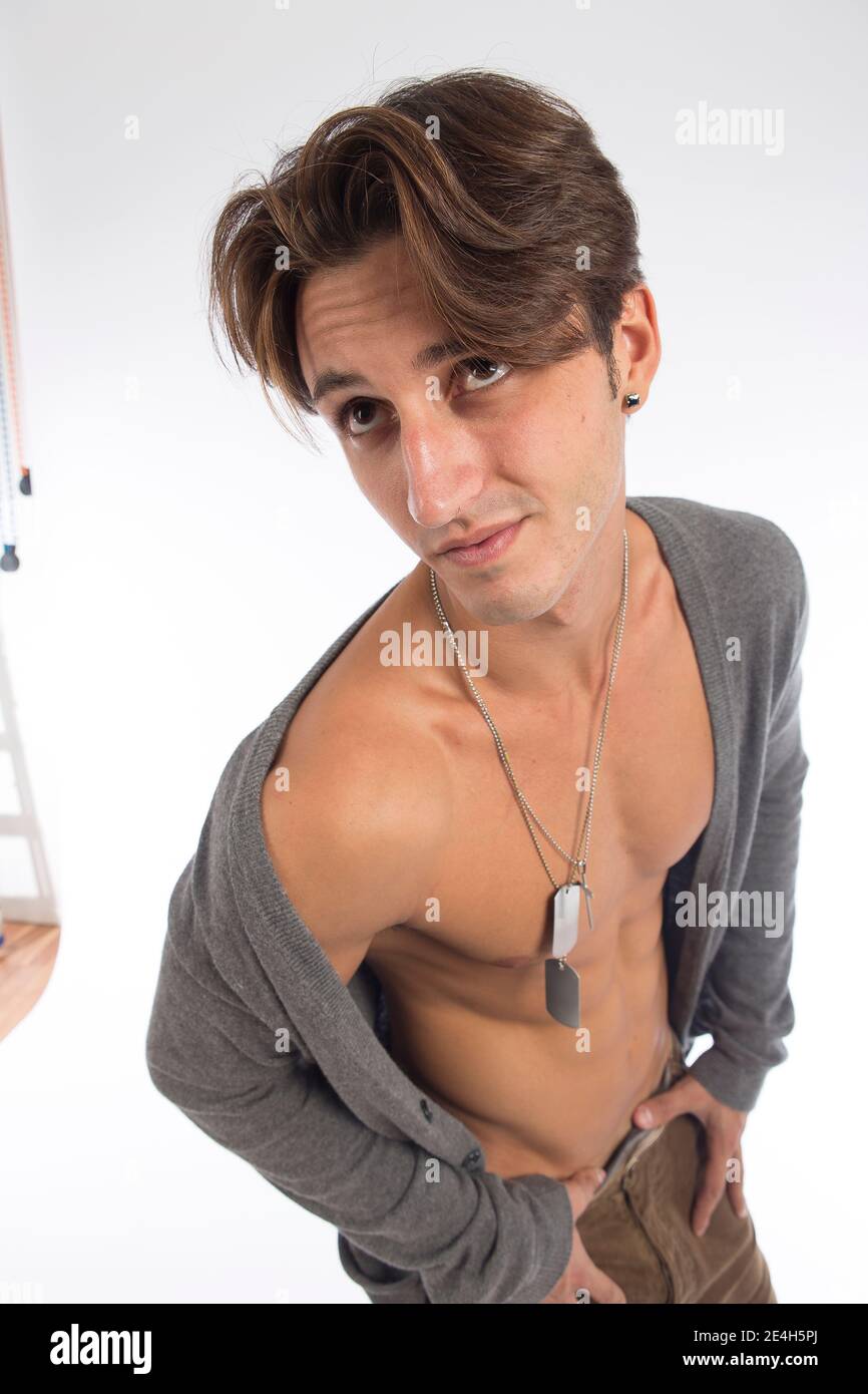 Studio portrait of a muscular built italian young man Stock Photo - Alamy
