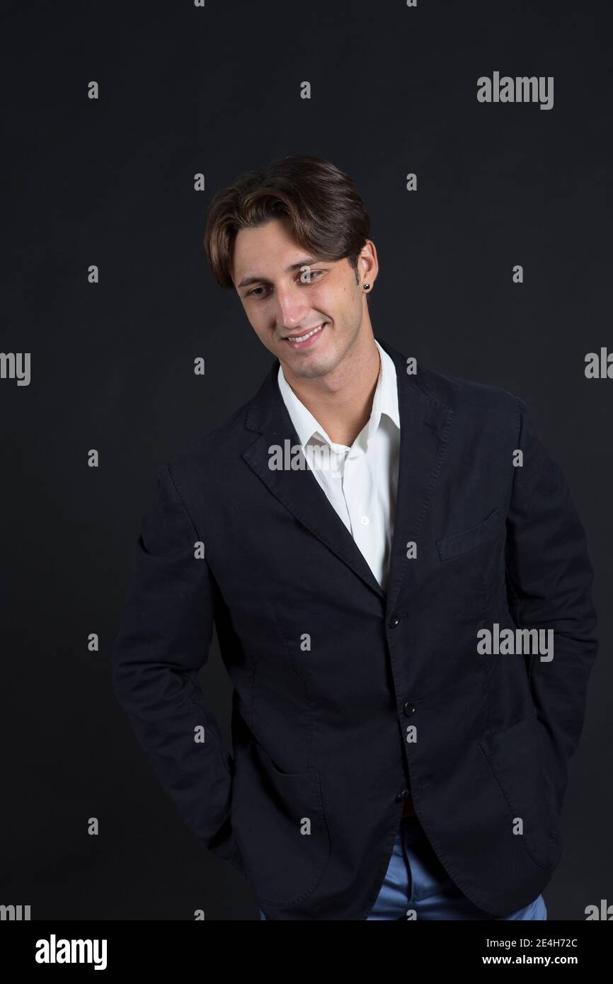 Studio portrait of a muscular built italian young man Stock Photo - Alamy