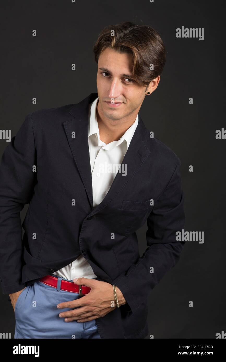 Studio portrait of a muscular built italian young man Stock Photo - Alamy