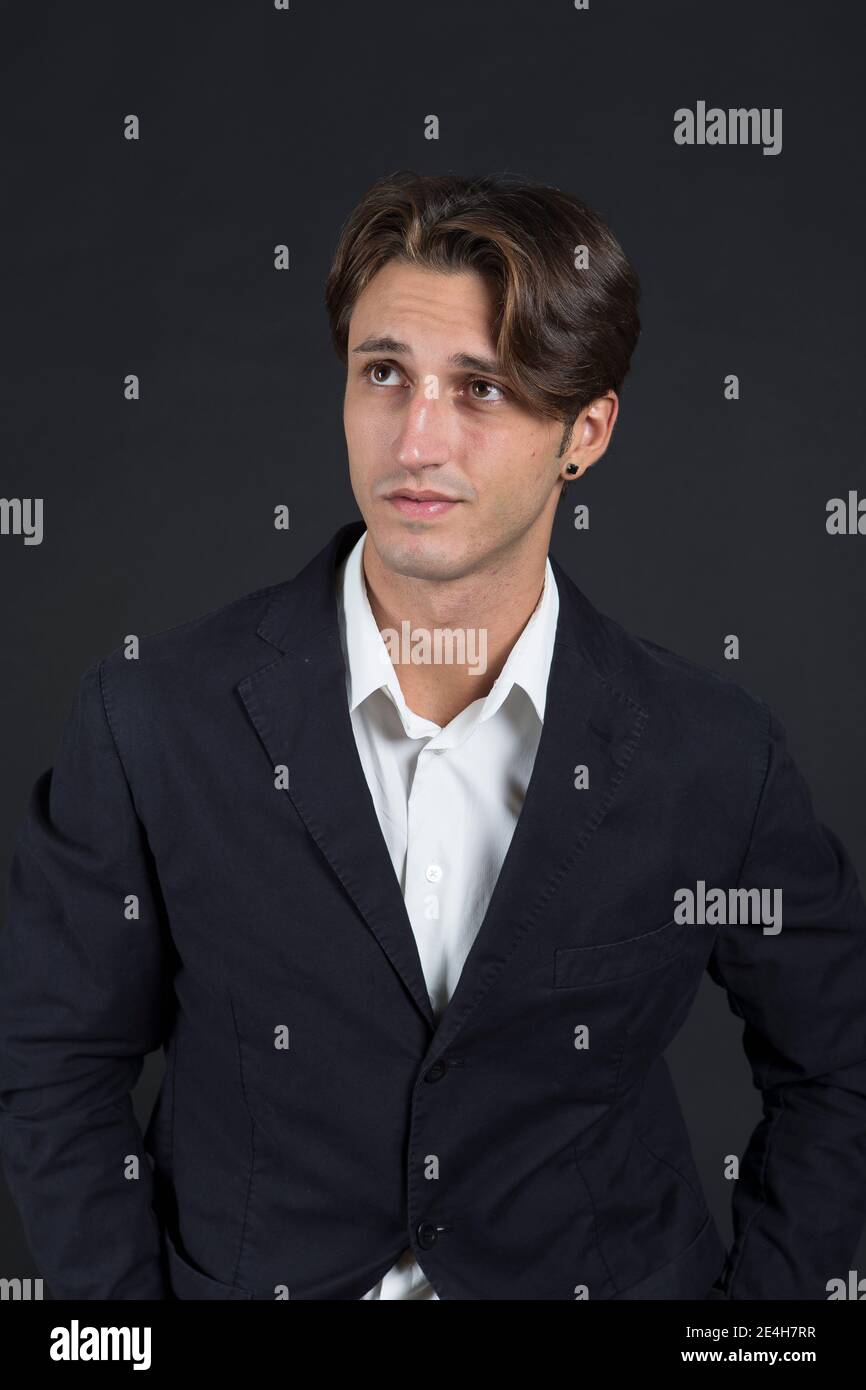 Studio portrait of a muscular built italian young man Stock Photo - Alamy