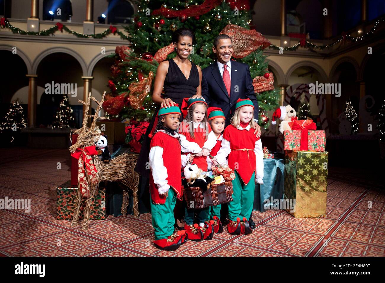 US President Barack Obama and First Lady Michelle Obama pose with ...