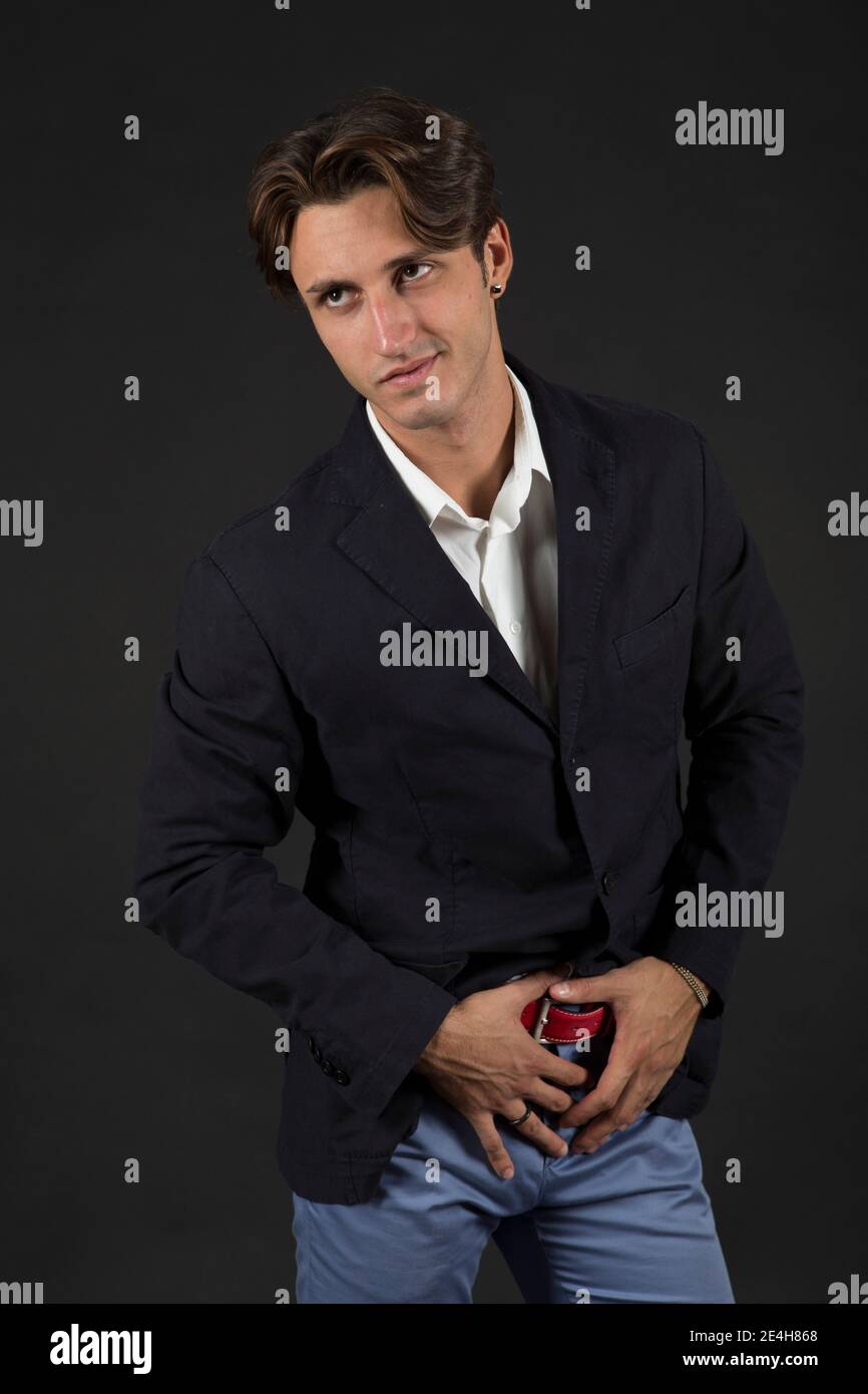Studio portrait of a muscular built italian young man Stock Photo - Alamy