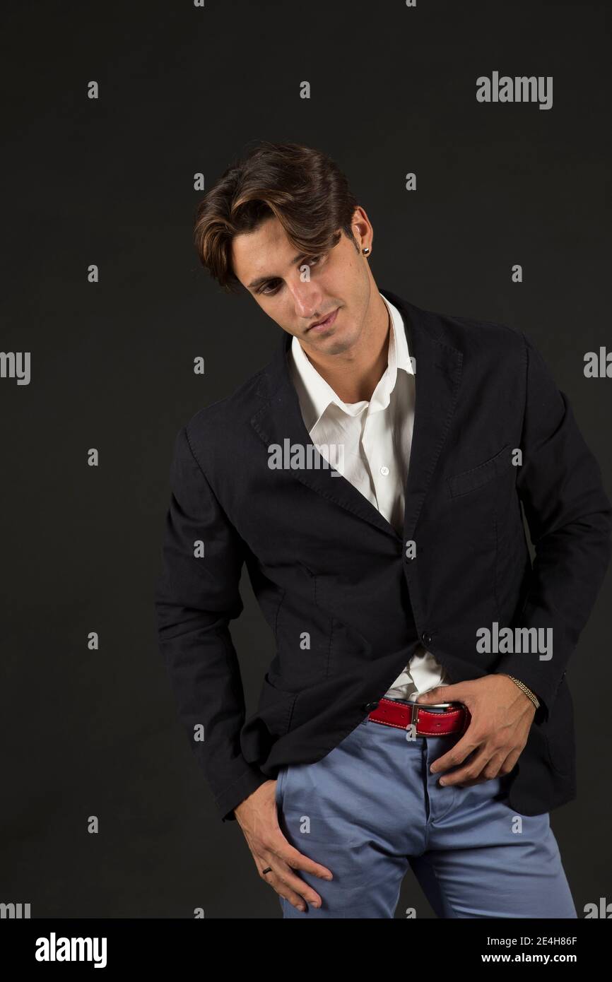 Studio portrait of a muscular built italian young man Stock Photo - Alamy