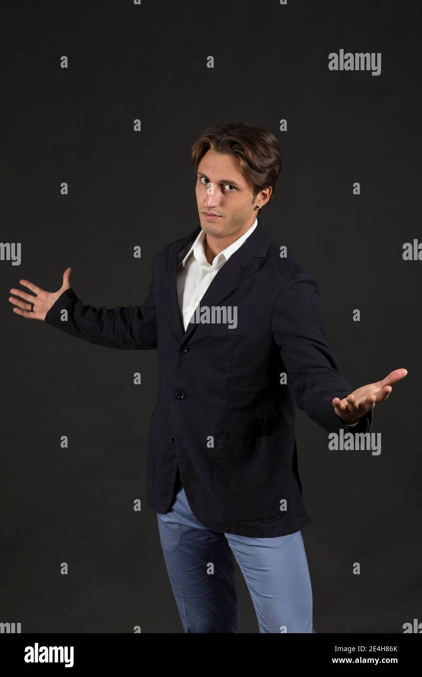 Studio portrait of a muscular built italian young man Stock Photo - Alamy