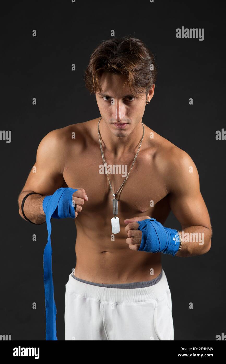 Studio portrait of a muscular built italian young man Stock Photo - Alamy