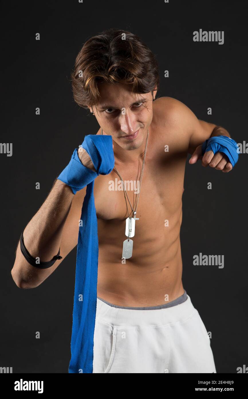 Studio portrait of a muscular built italian young man Stock Photo - Alamy
