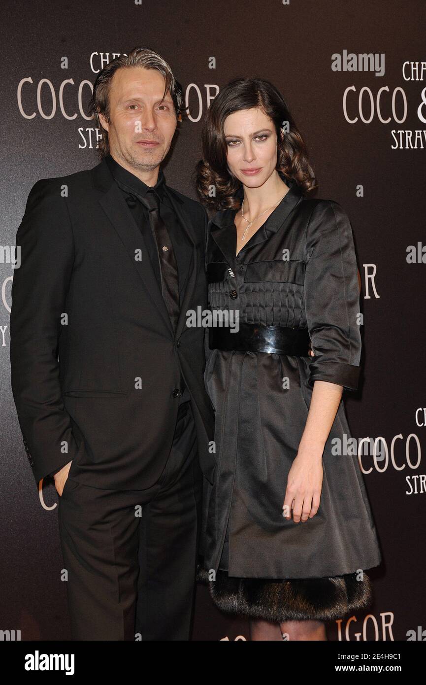 Mads Mikkelsen and Anna Mouglalis attending the premiere of 'Coco ...