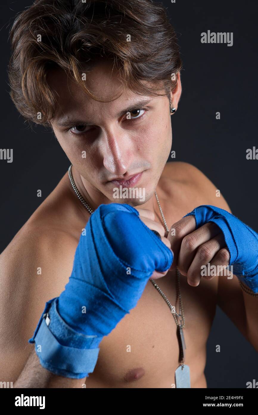 Studio portrait of a muscular built italian young man Stock Photo - Alamy